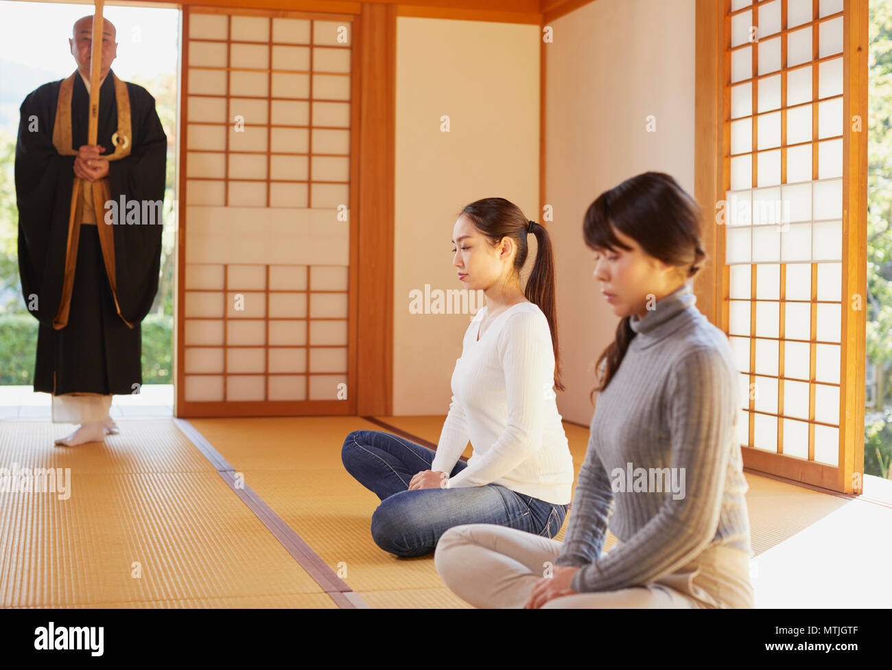 Japanese priest preaching to women at a temple Stock Photo - Alamy