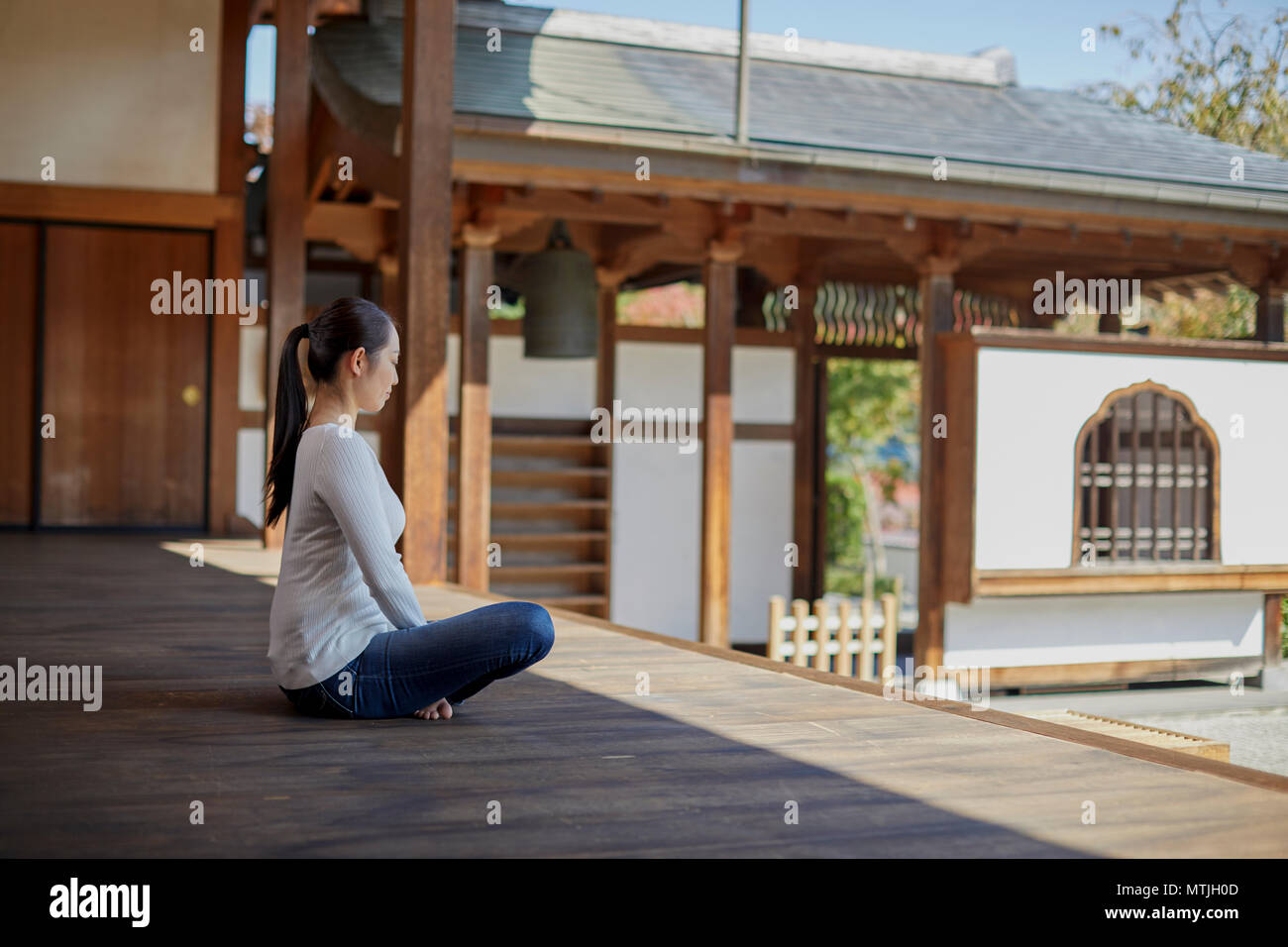 Japanese woman at a temple Stock Photo - Alamy