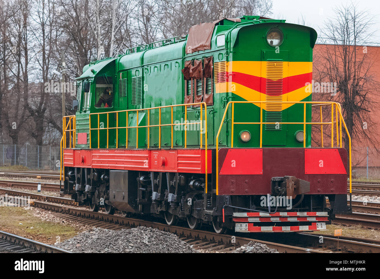 Green diesel cargo locomotive. Freight train in action Stock Photo - Alamy