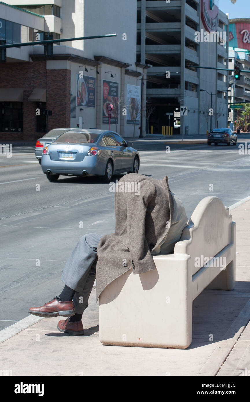 Vegas - tramp on bench with coat on head Stock Photo - Alamy