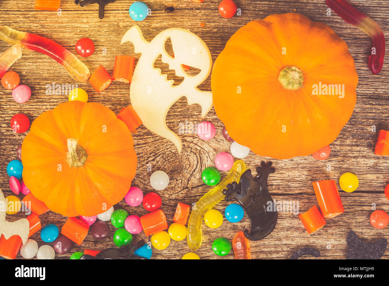 Trick and treat - colorful halloween scene on aged wood, retro toned ...