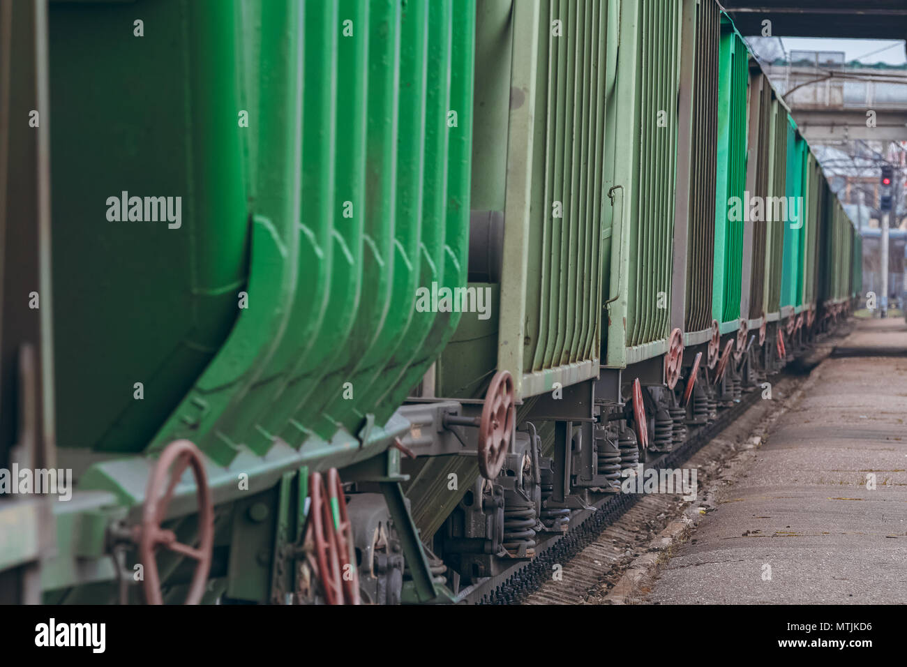 Green cargo wagons. Freight train in action Stock Photo - Alamy