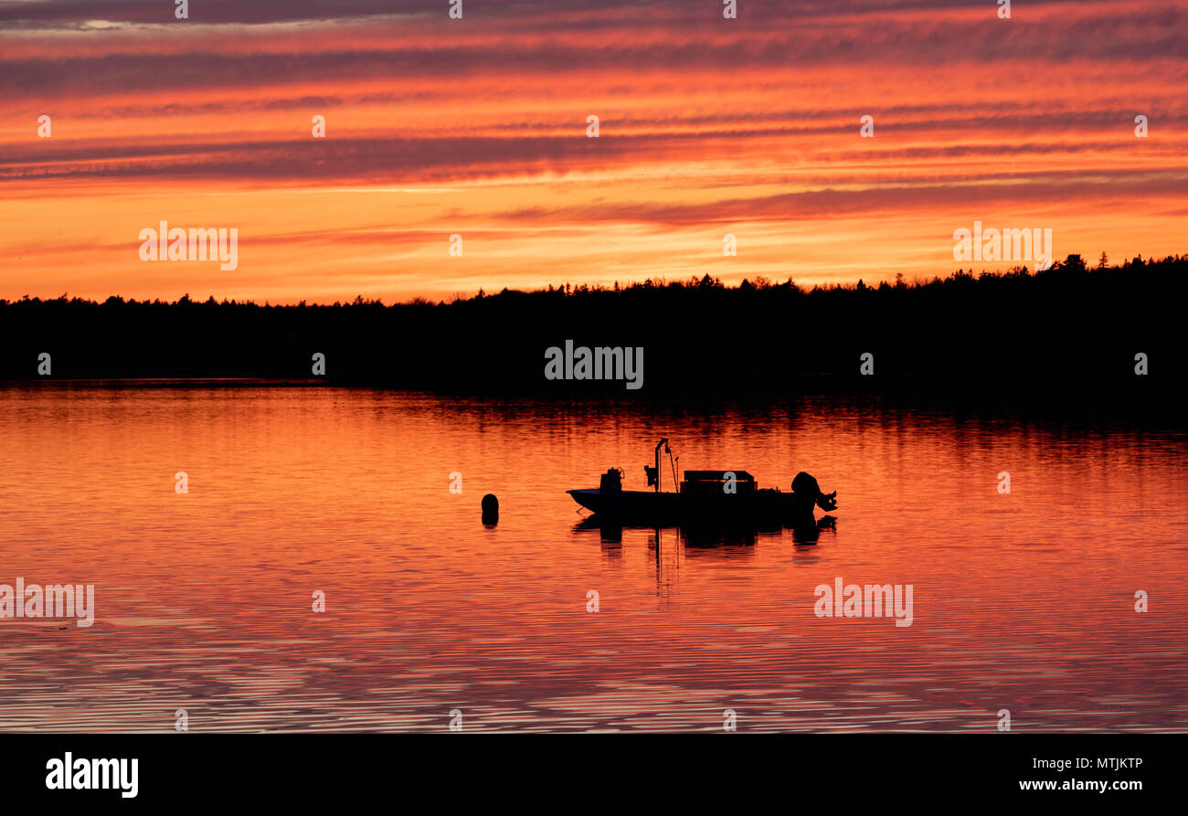 Fishing Boat in Sunset Stock Photo - Alamy