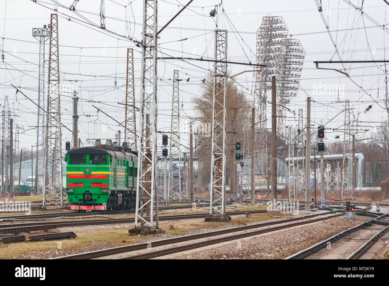 Green diesel cargo locomotive. Freight train in action Stock Photo - Alamy