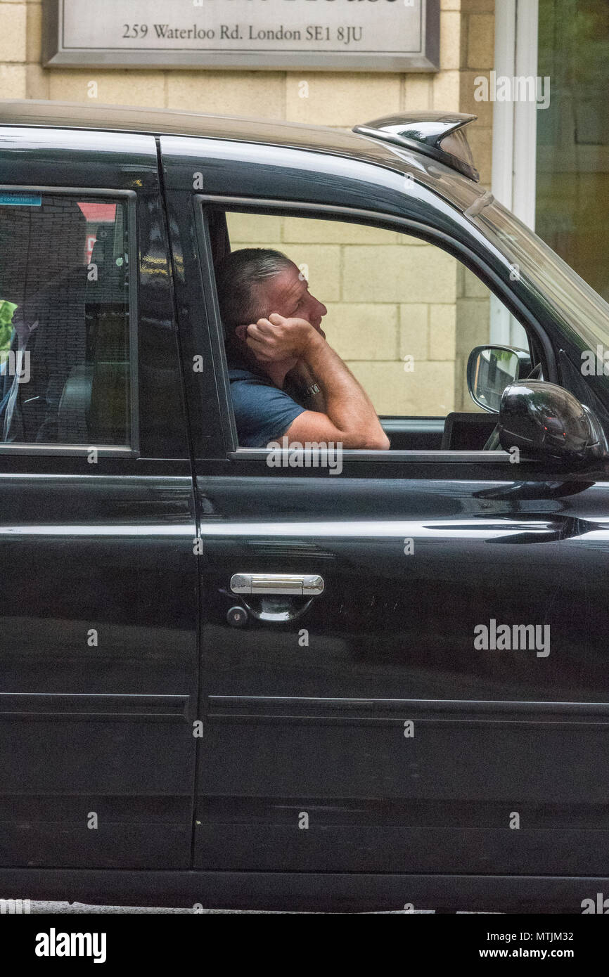 a london taxi driver stuck in a traffic jam in central london. london ...