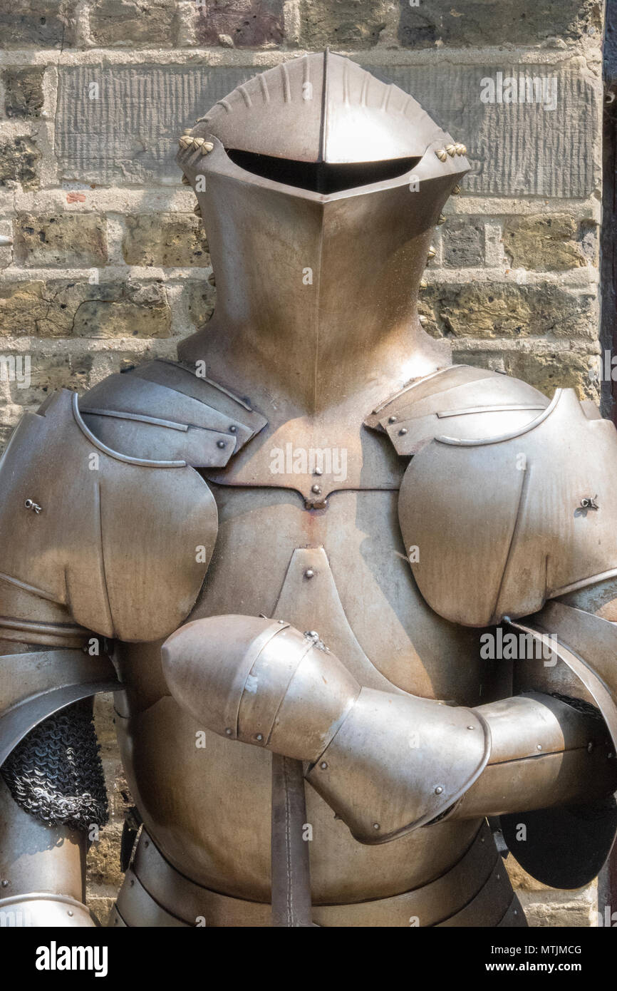 a suit of armour replica outside of a restaurant in st katherine dock ...