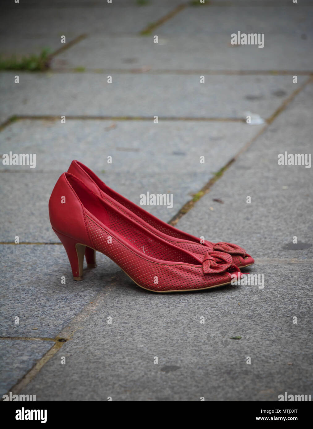 Women in red shoes hi-res stock photography and images - Alamy