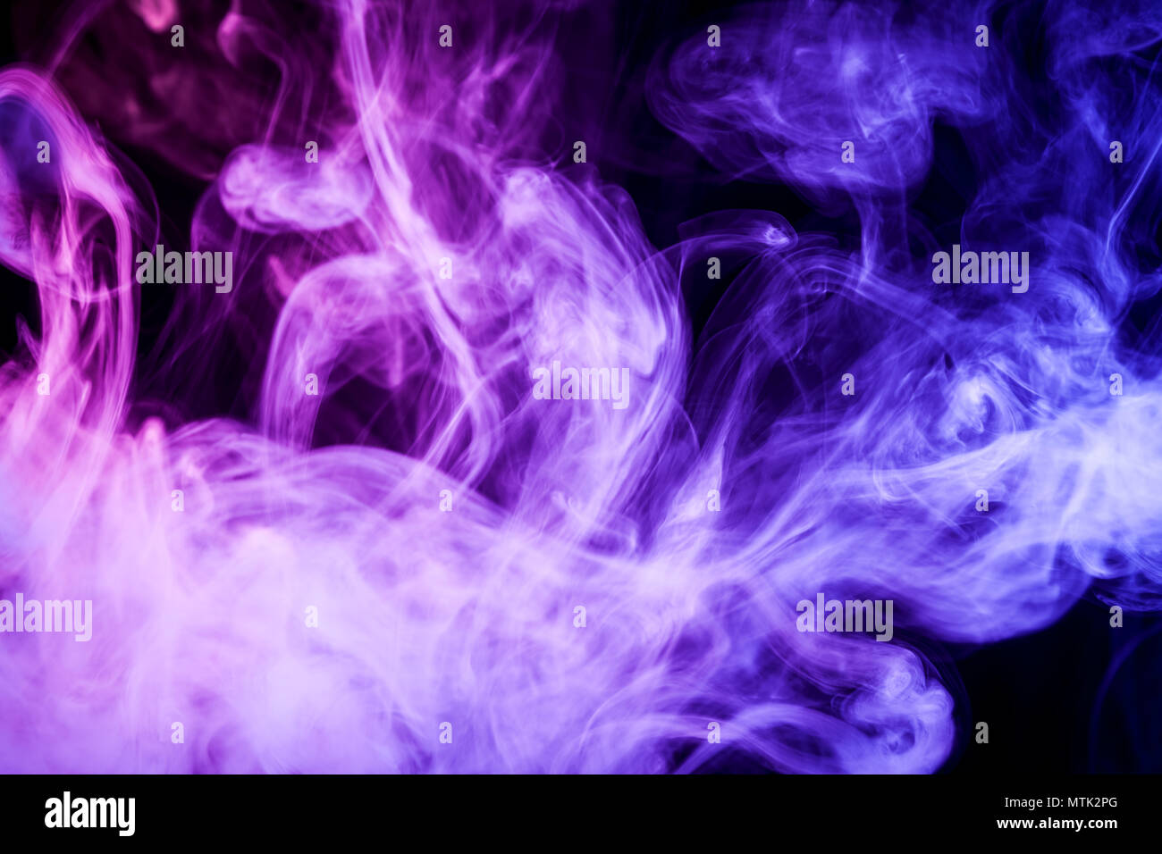 Cloud of purple smoke on a black isolated background. Background from ...