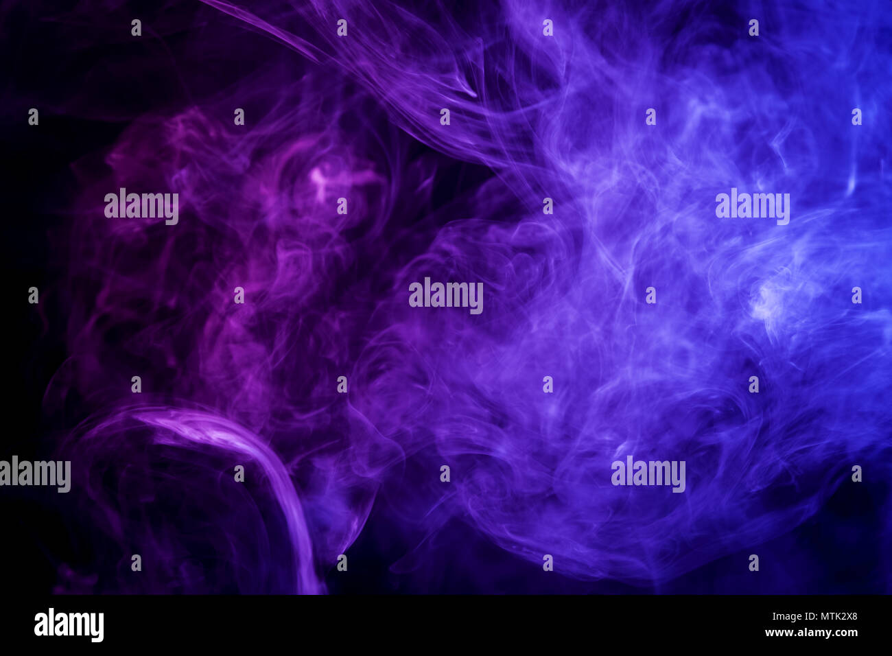 Cloud of purple smoke on a black isolated background. Background from ...