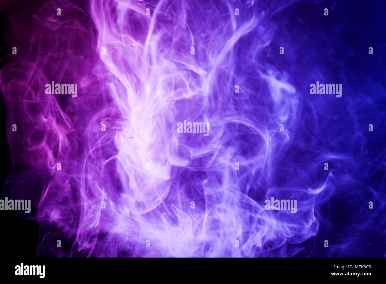 Cloud of purple smoke on a black isolated background. Background from ...