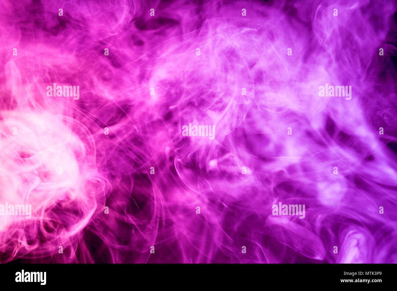 Cloud of pink smoke on a black isolated background. Background from the ...