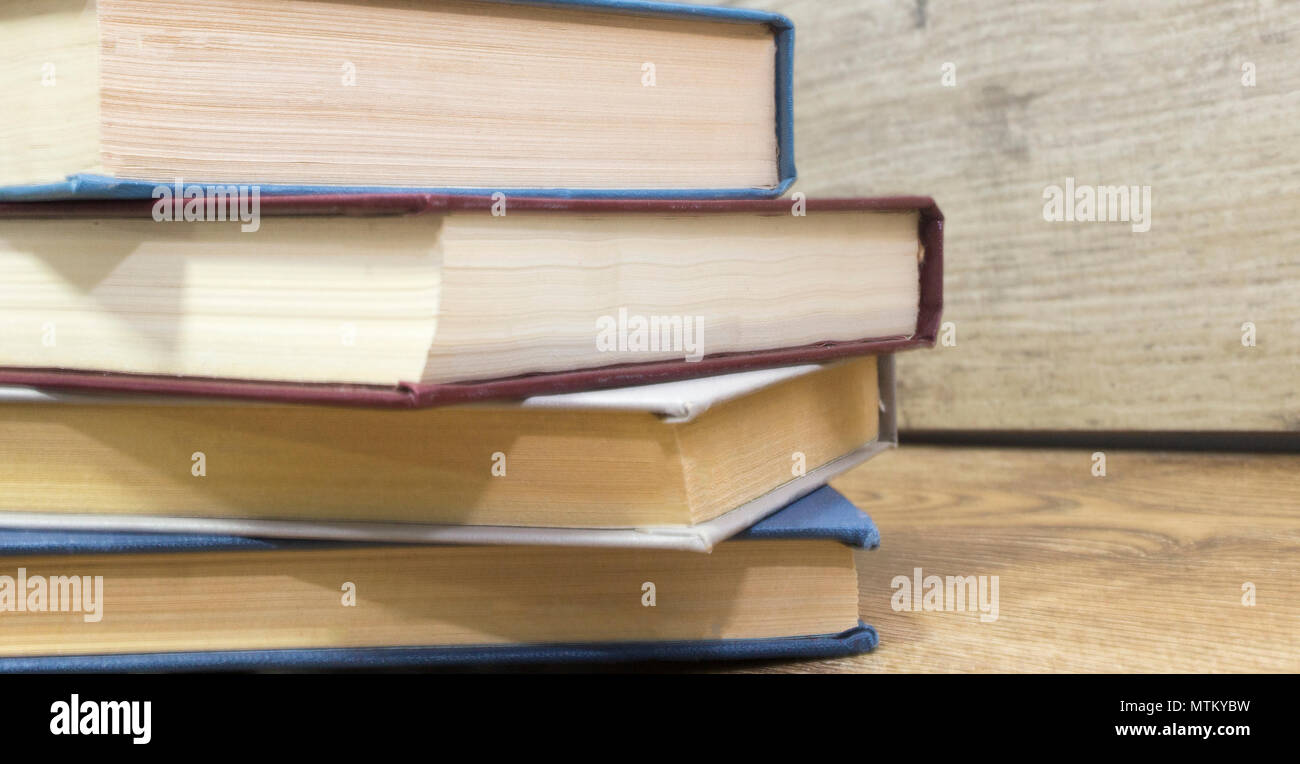 Front view of old books lying on the table Stock Photo - Alamy