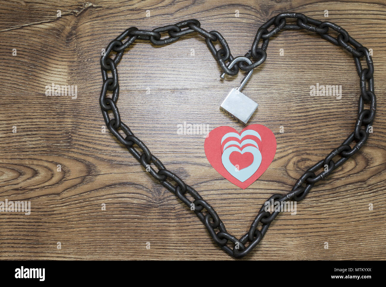 Red, blue heart cards inside the chained heart Stock Photo - Alamy