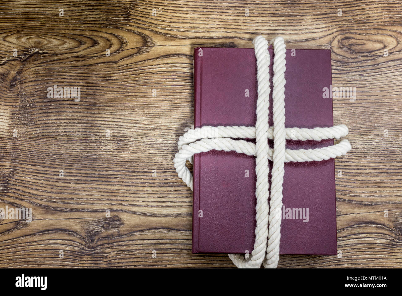Rope around a book hi-res stock photography and images - Alamy