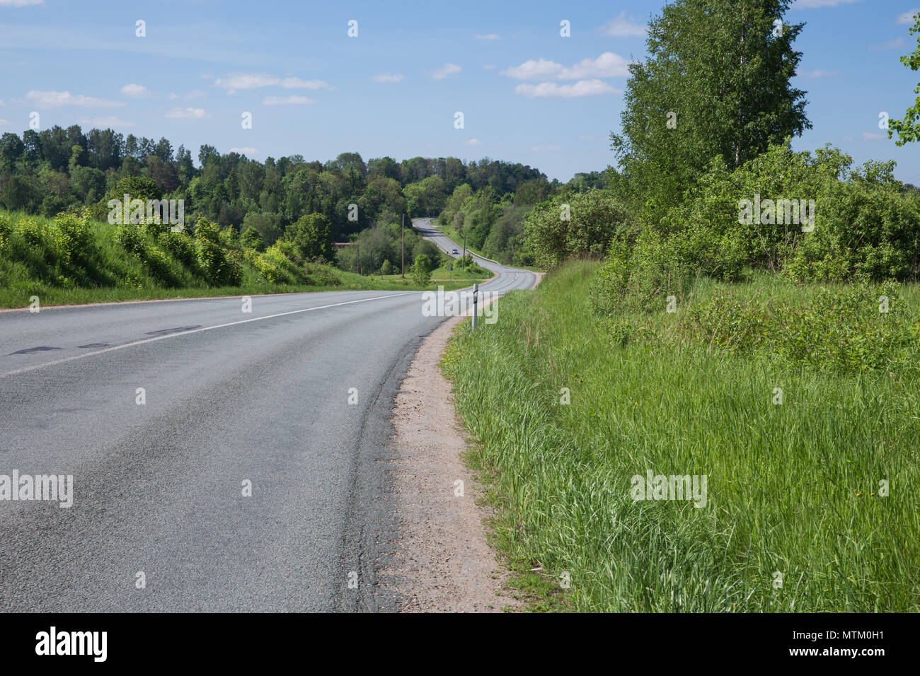 City Cesis, Latvia. Old way and trees. Blue sky and nature. Travel ...