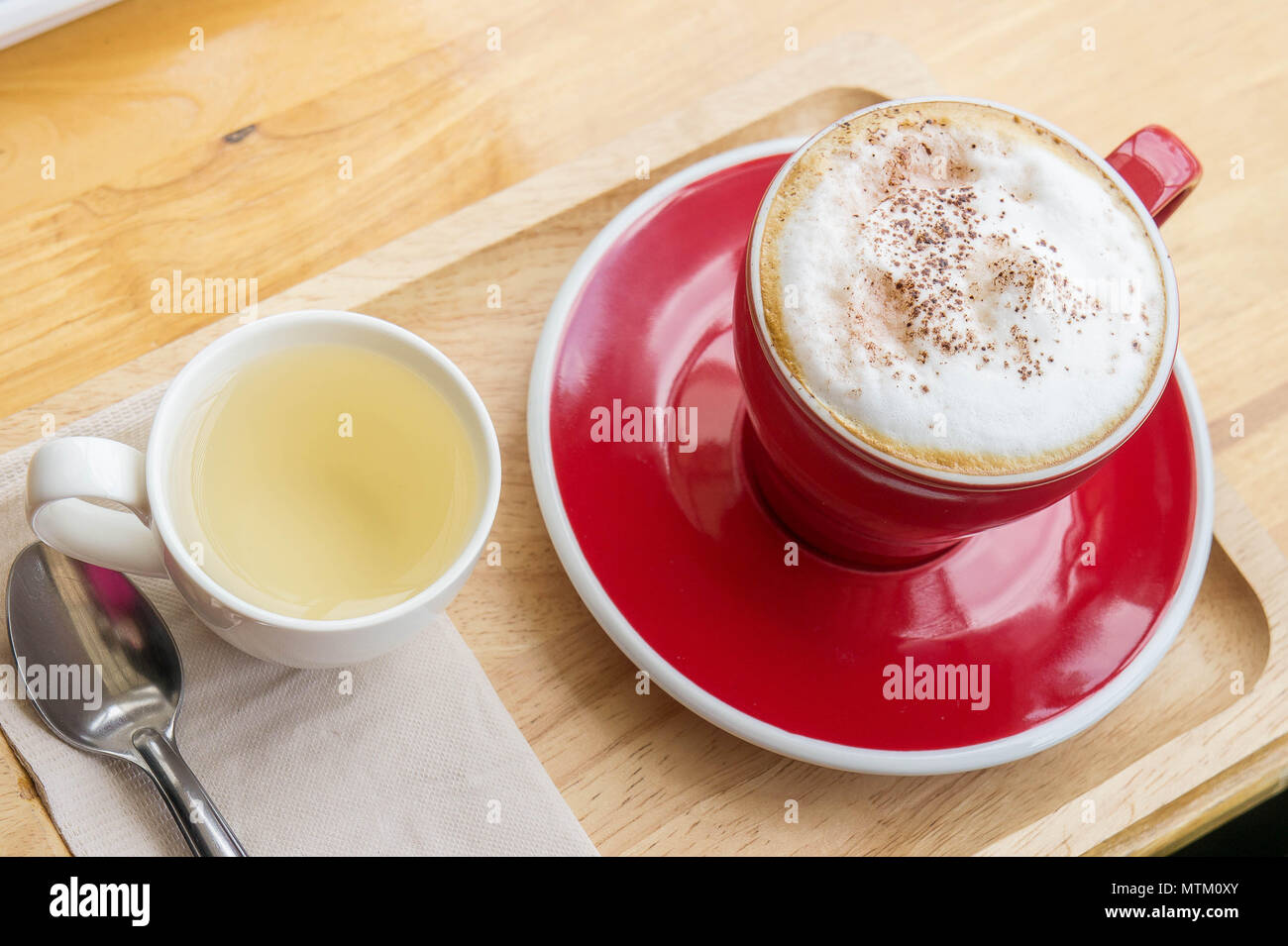 coffee red cup on wood table in coffee shop Stock Photo - Alamy