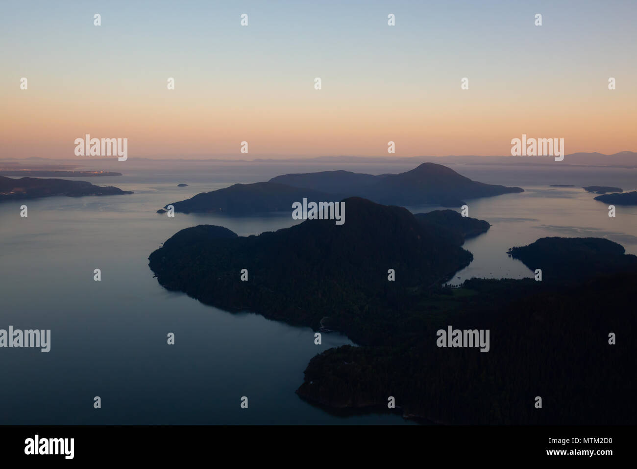 Aerial view of Howe Sound during a vibrant sunset. Taken North of ...
