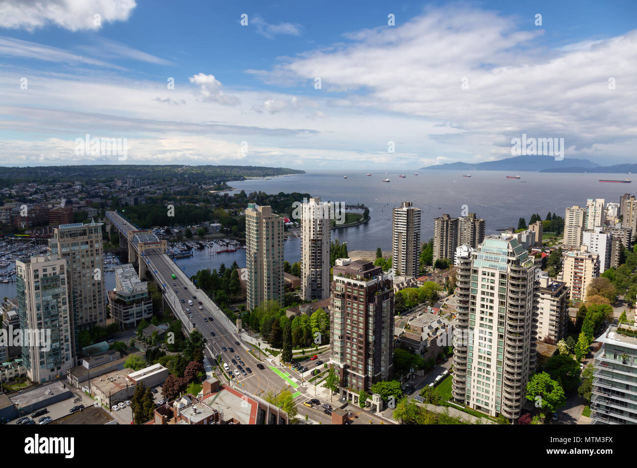 Aerial view of a beautiful modern cityscape during a cloudy day.Taken ...