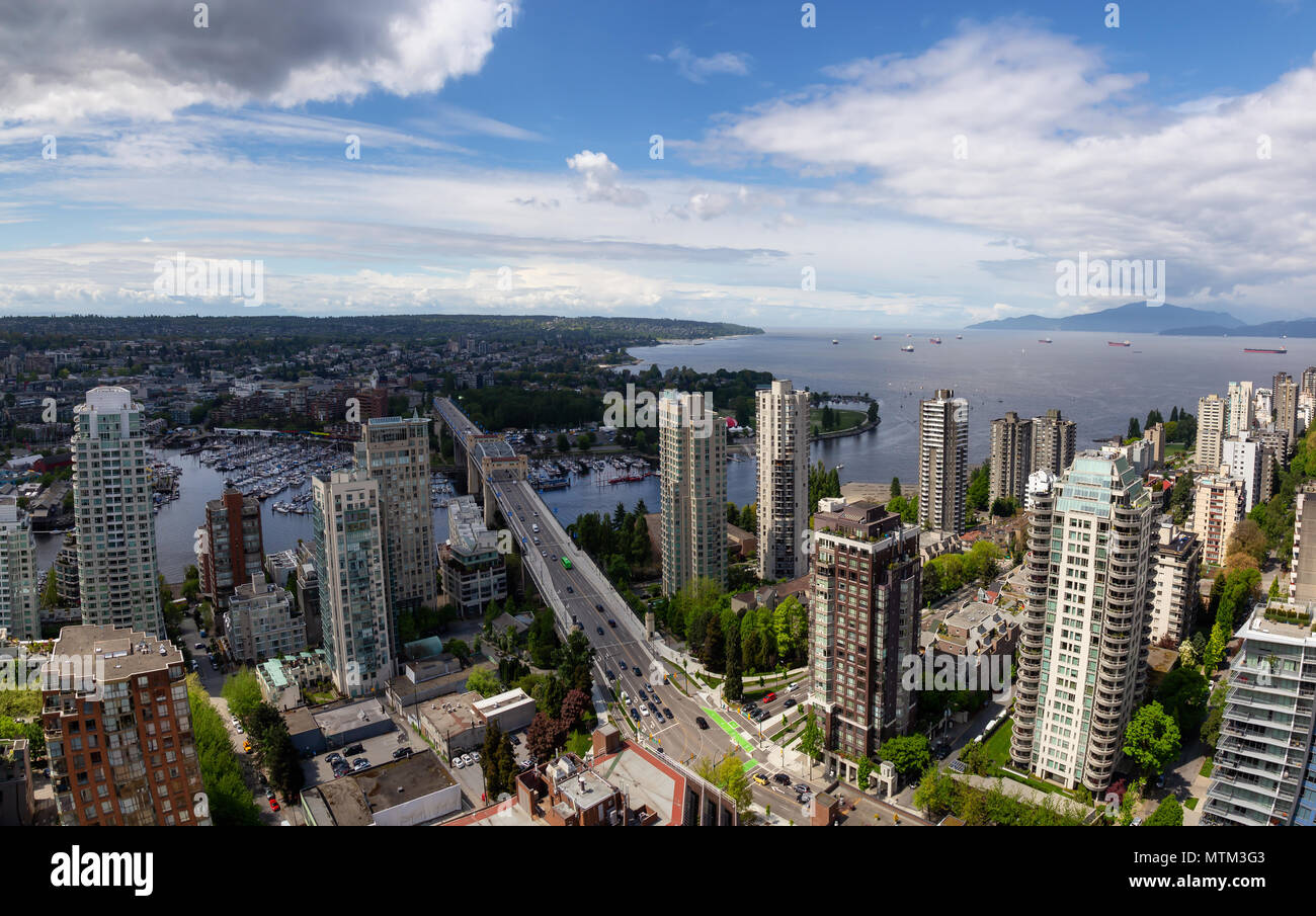 Aerial panoramic view of a beautiful modern cityscape during a cloudy ...