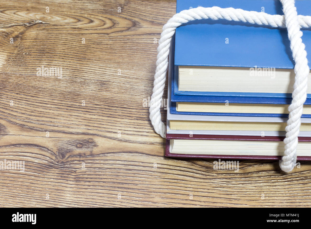 Books tied up hi-res stock photography and images - Alamy