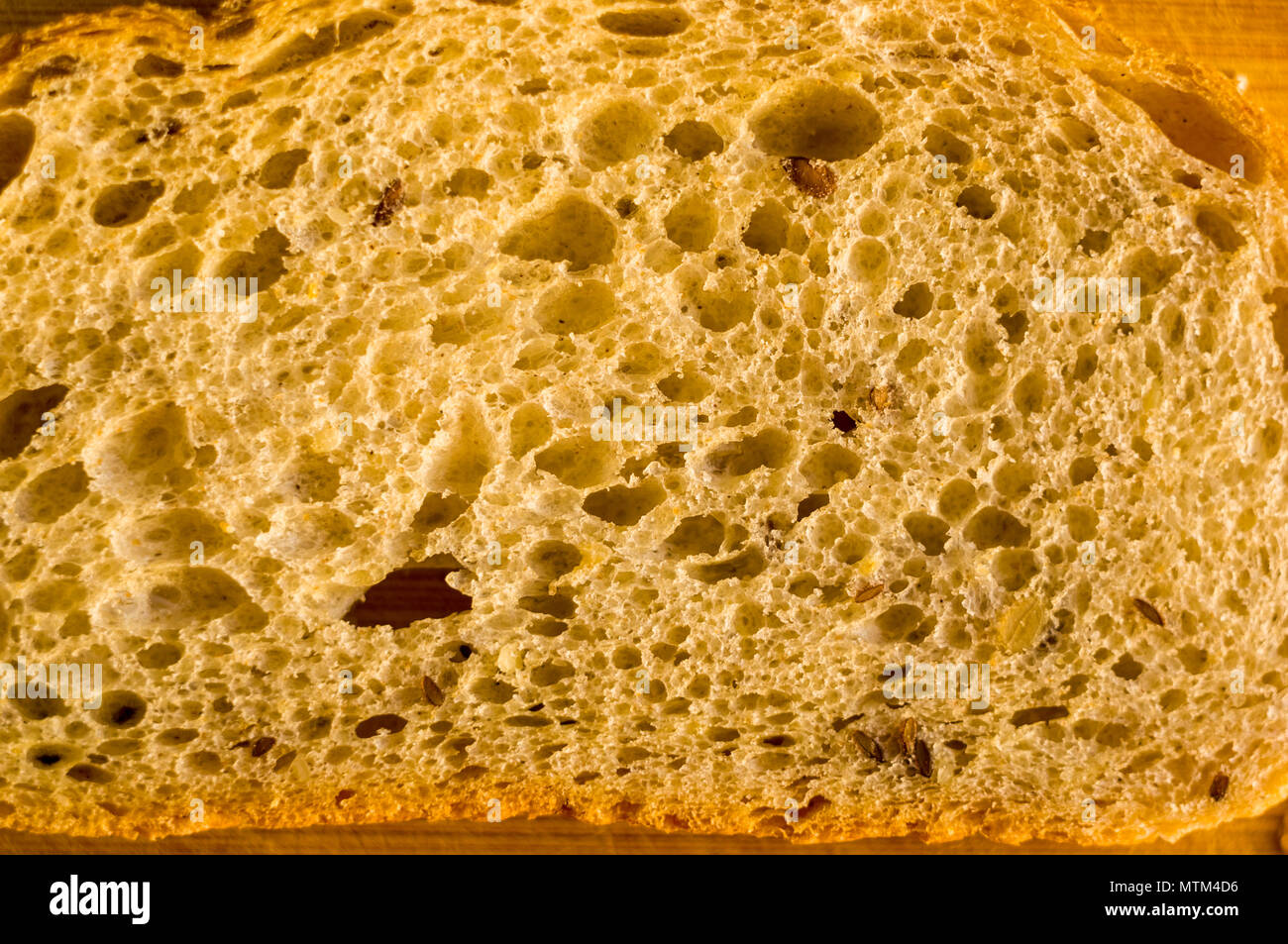 sliced whole wheat breads on a chopping Board Stock Photo - Alamy