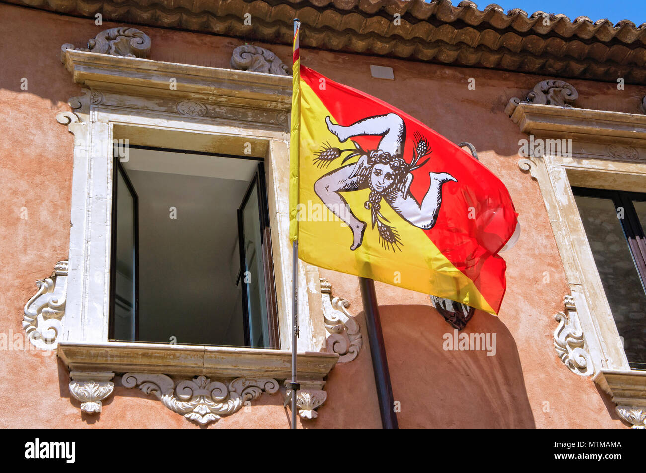 Sicilian flag on an old building Stock Photo - Alamy