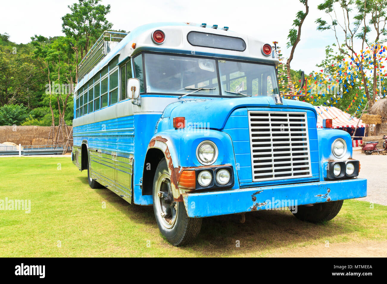 vintage blue bus in garden Stock Photo - Alamy