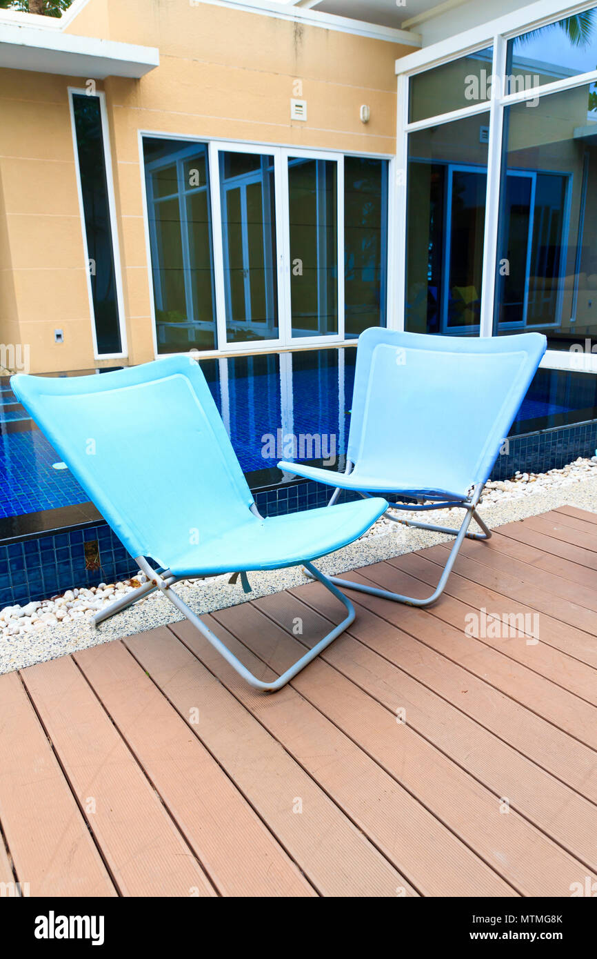 Relax chairs luxury hotel swimming pool Stock Photo - Alamy