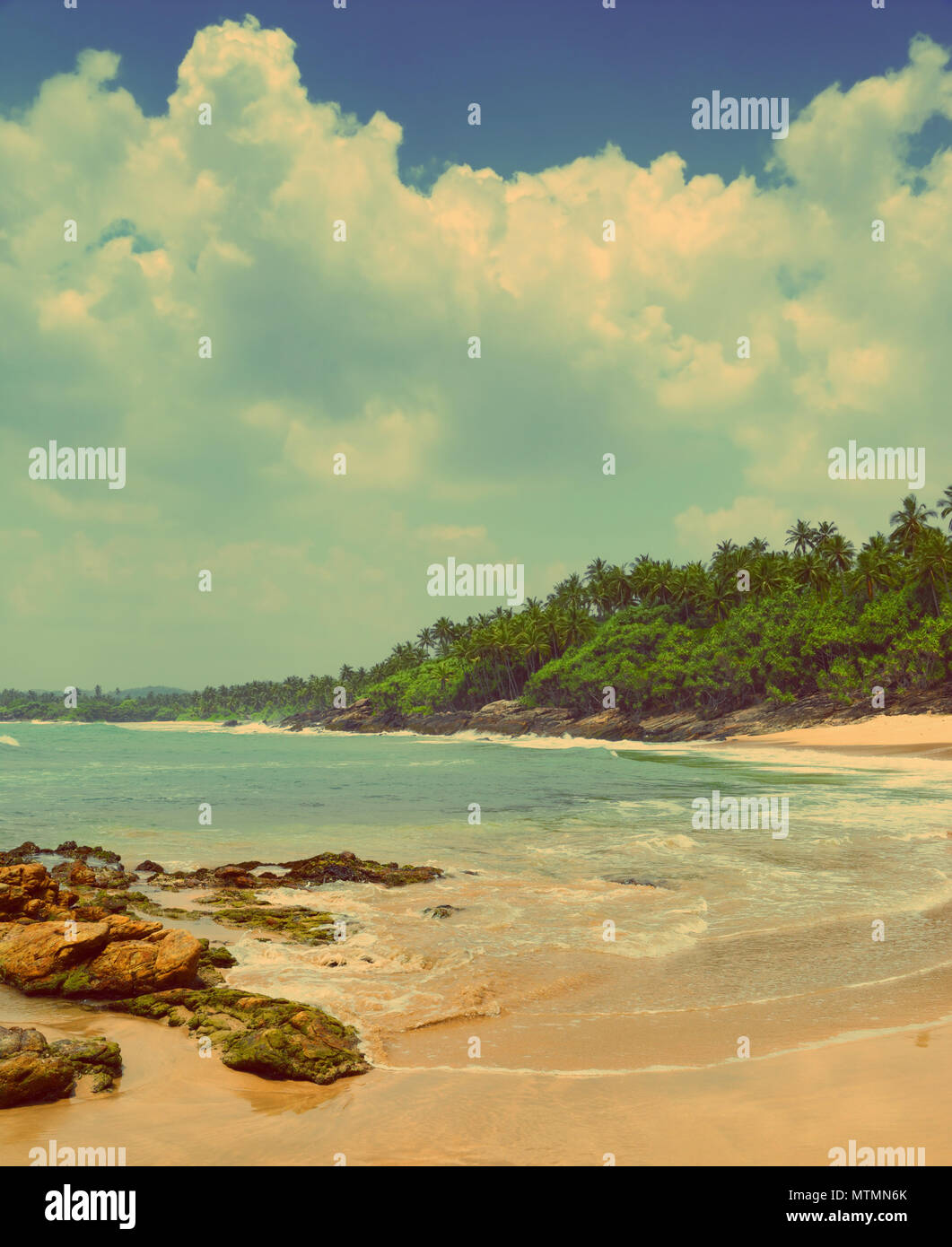 Tropical beach with stones hi-res stock photography and images - Alamy