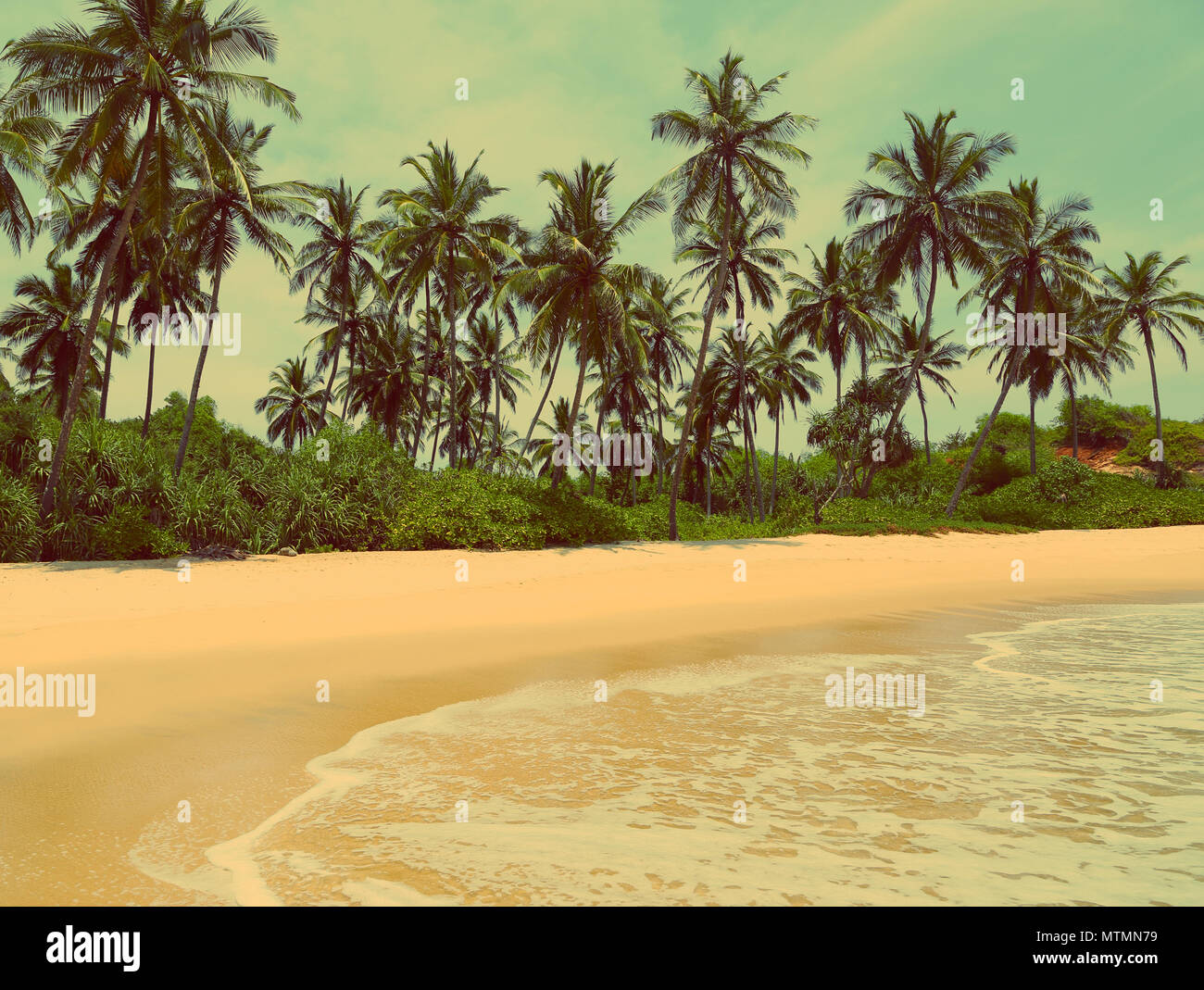 tropical beach - vintage retro style Stock Photo - Alamy