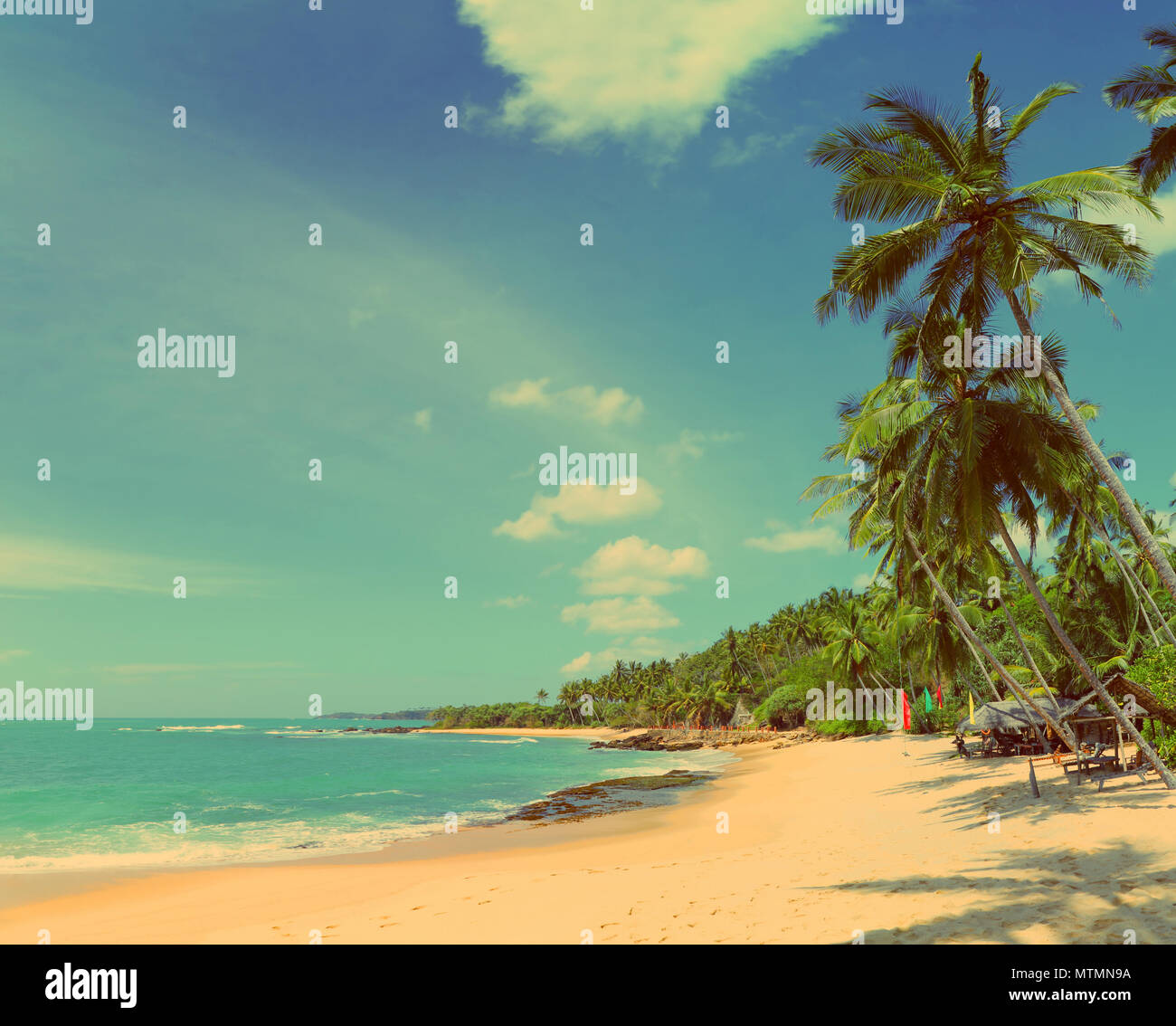 tropical beach - vintage retro style Stock Photo - Alamy