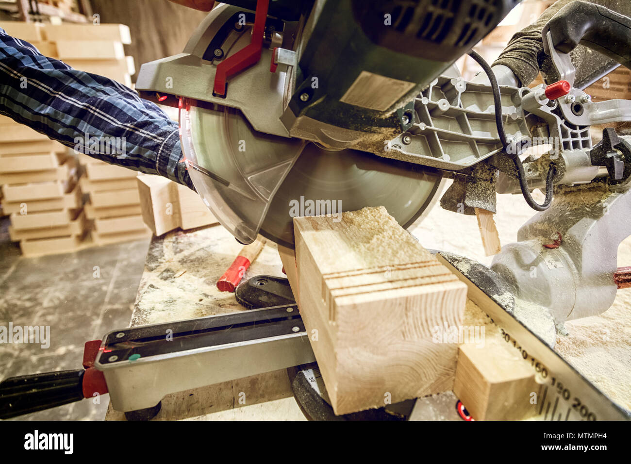 Man using miter saw to cut wood hi-res stock photography and images - Alamy