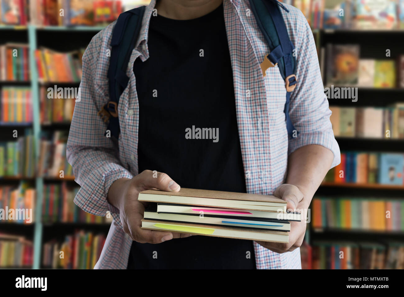 young man In the library books high school library Stock Photo - Alamy