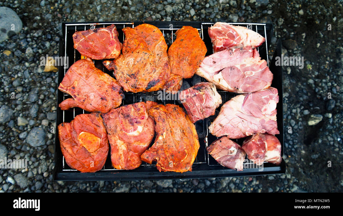 Lamb steaks cooking on disposable grill in Iceland Stock Photo - Alamy