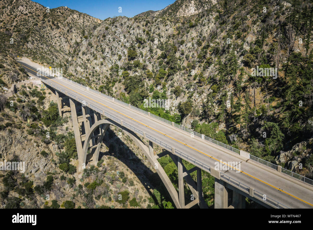 Overhead view of a long span bridge in the desert mountains above Los ...