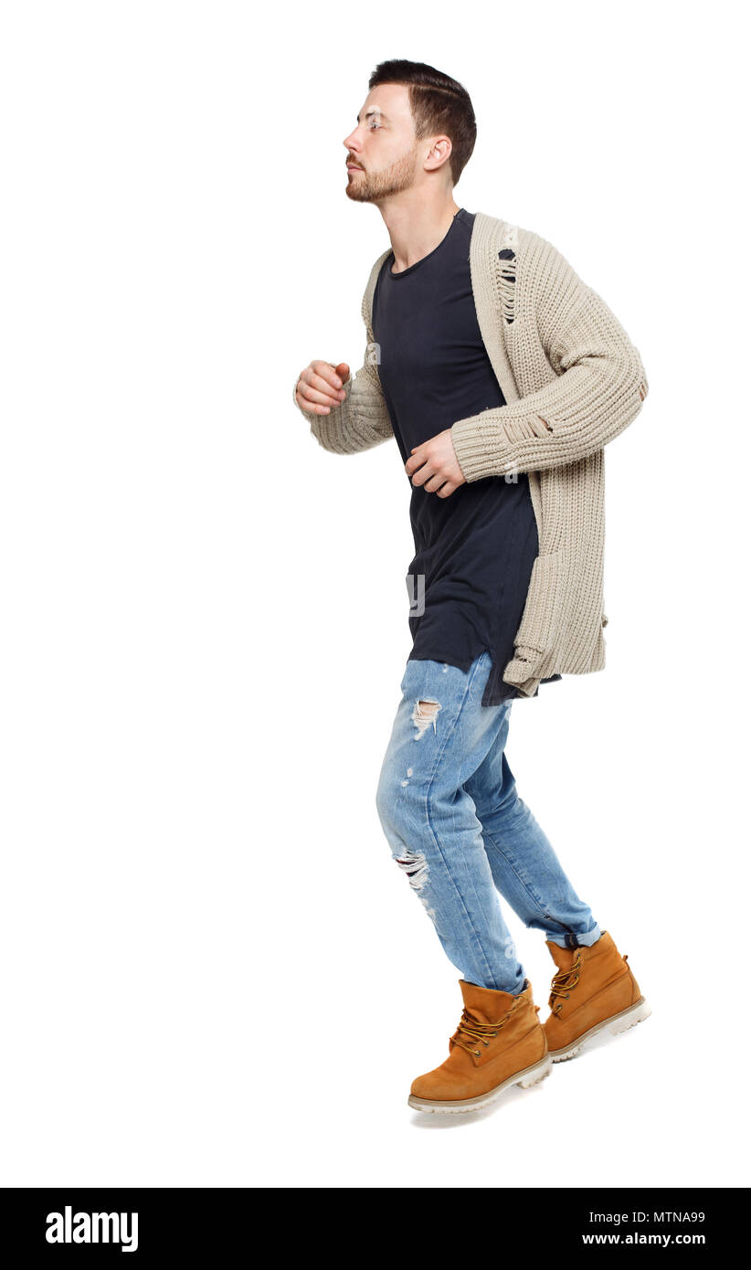 Back view of a running man in sweater. backside view of person. Rear ...