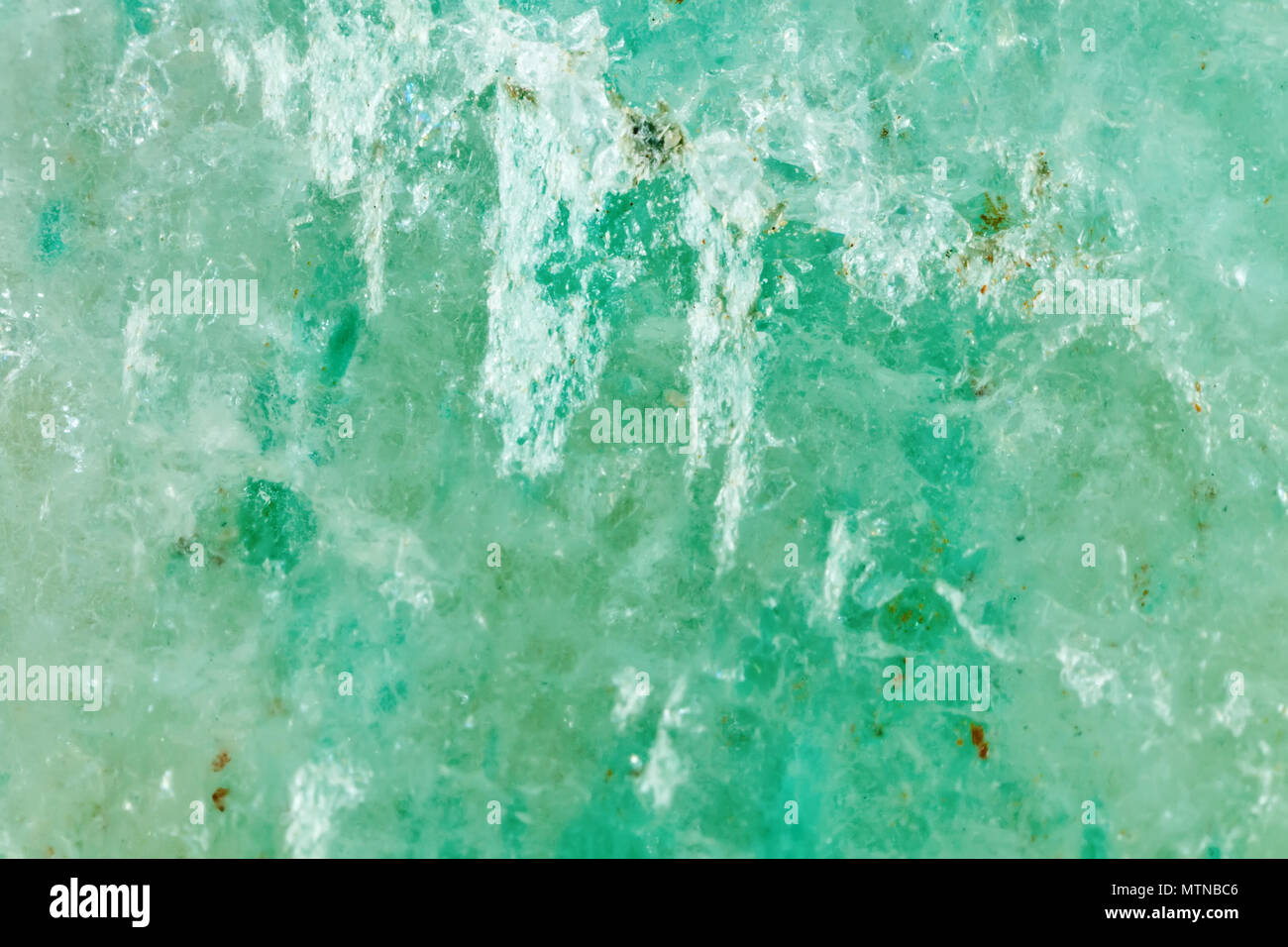 The mineral is jadeite. The texture of the mineral. Macro shooting of ...