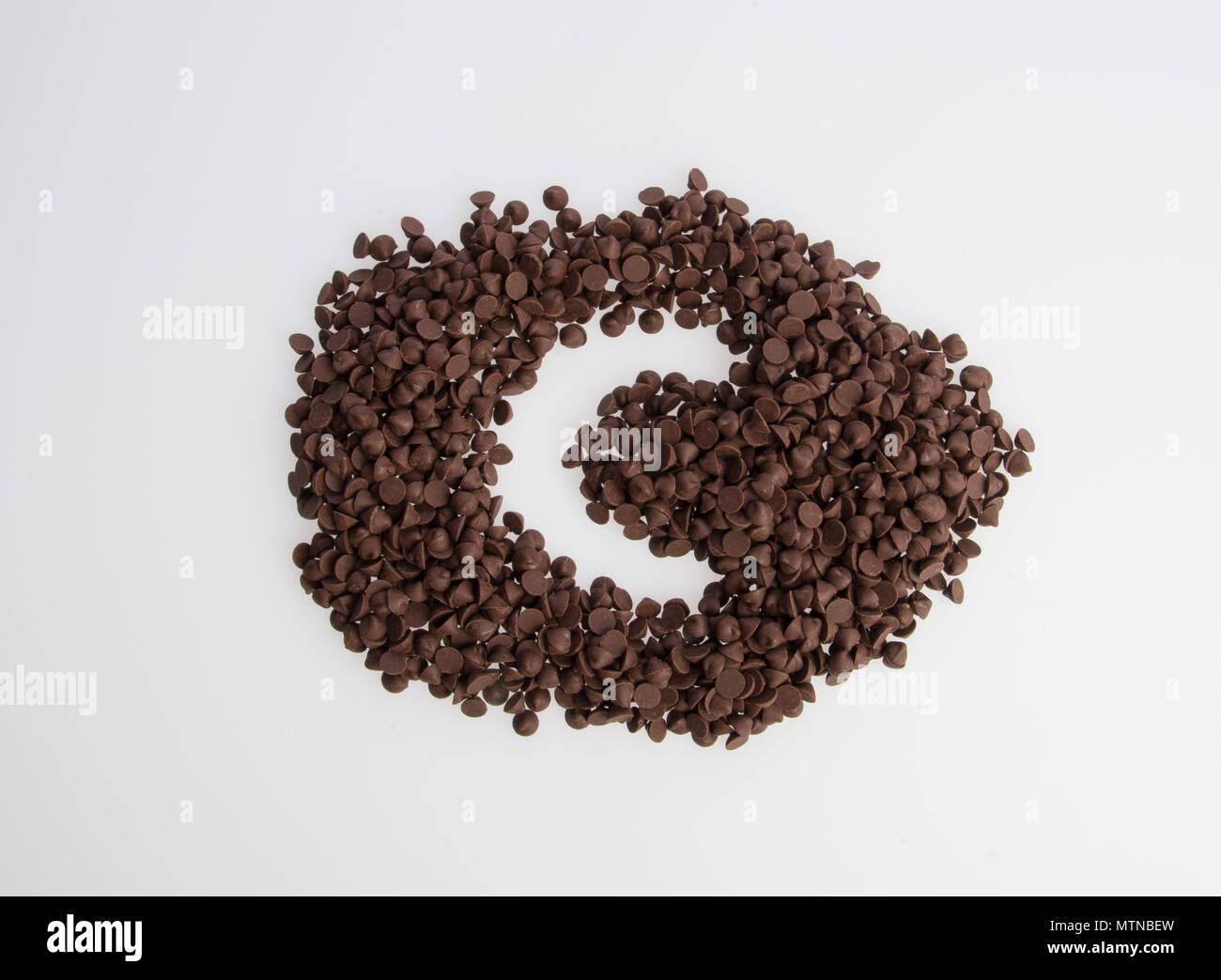 Chocolate chip morsels spread with concept c Stock Photo - Alamy