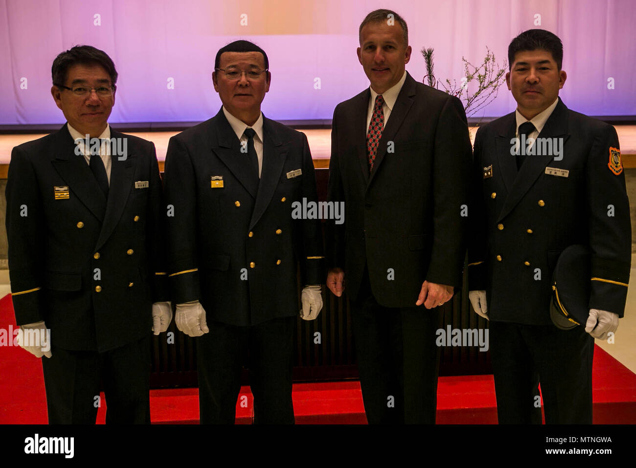 From left to right, Takeshi Noha, the Kin Town Fire Department Chief ...