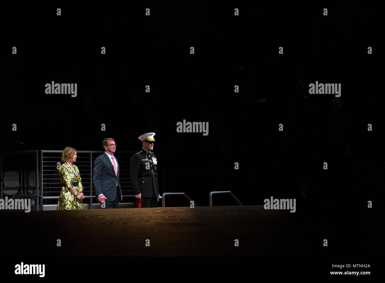 Defense Secretary Ash Carter, center, his wife Stephanie Carter, left ...