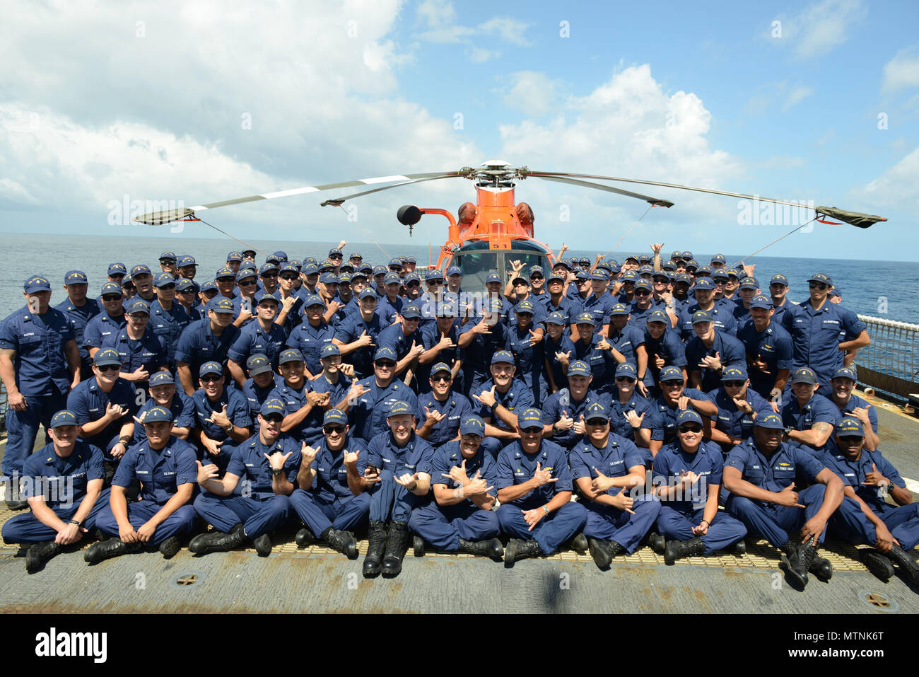 EASTERN PACIFIC OCEAN - The crew of the Coast Guard Cutter Sherman pose ...