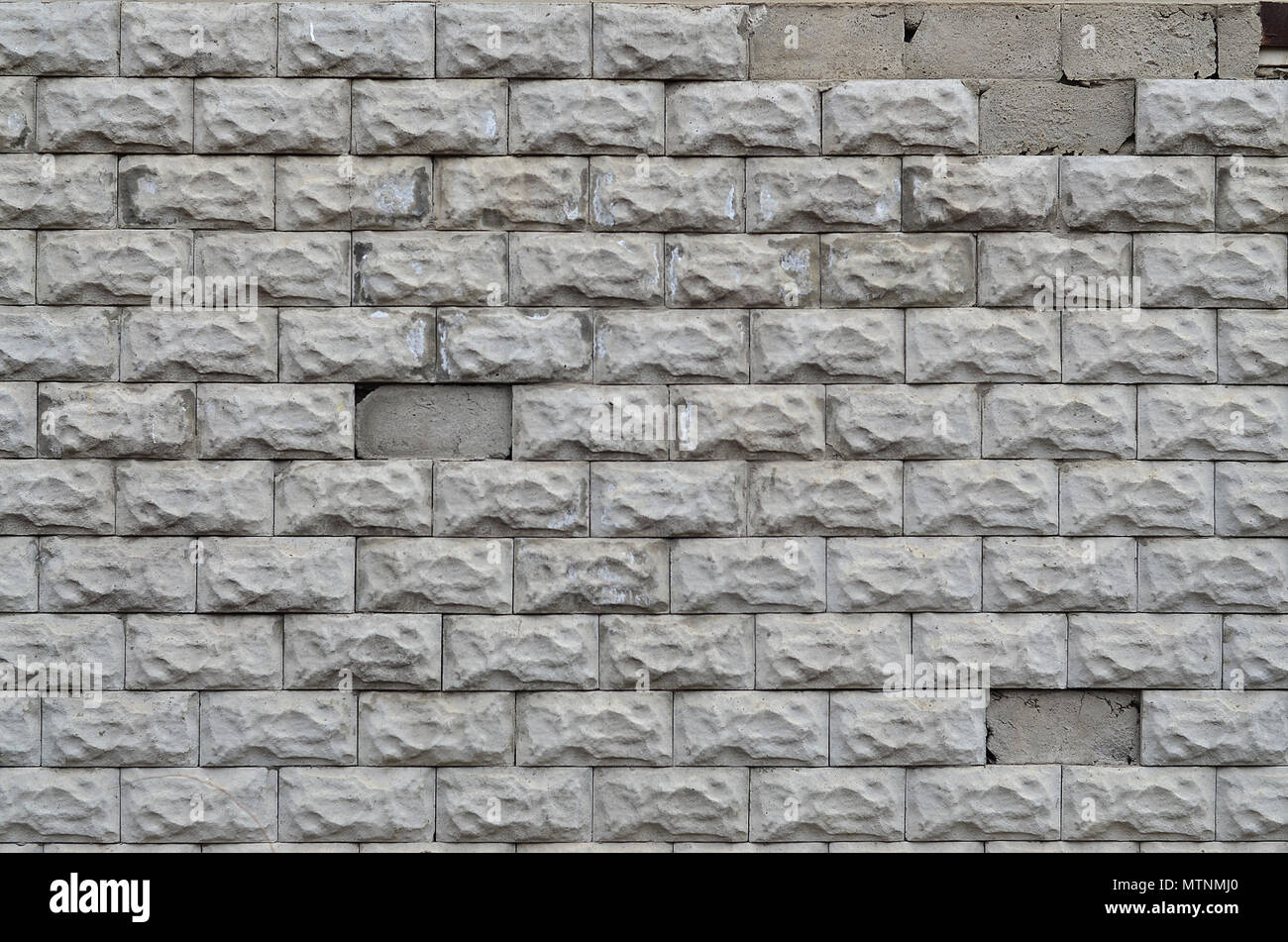 Weathered stained old block wall background. Texture of an old wall of ...