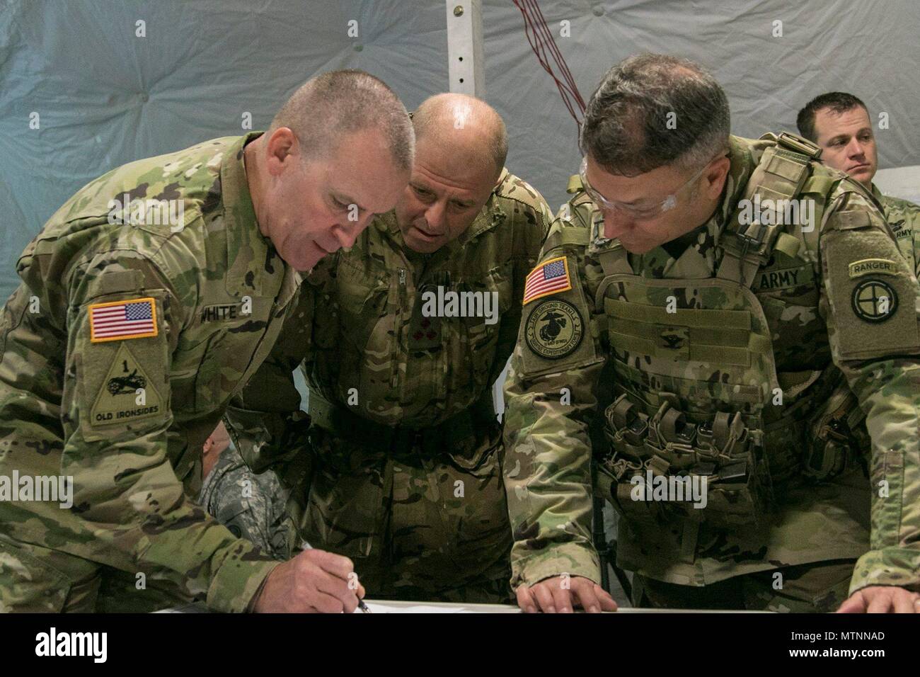 Maj. Gen. Robert P. White, 1st Armored Division commanding general, and ...