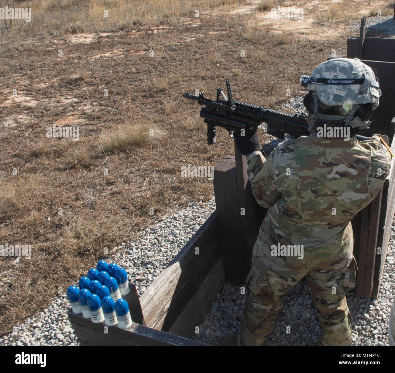 A soldier with the 193rd Infantry Brigade fires an M320A1 grenade ...