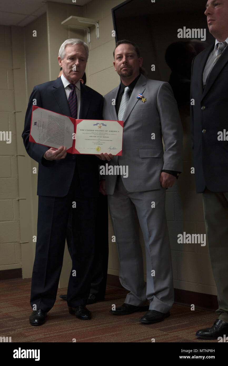 The Secretary of the Navy, Ray Mabus, presents the Silver Star to ...