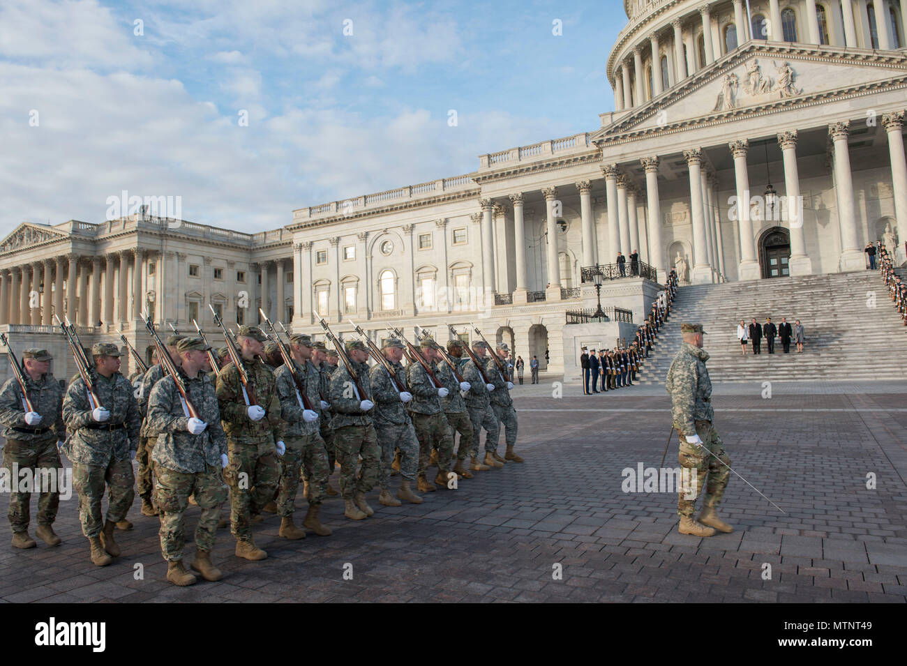 The U.S. Army Honor Guard marches pass the U.S. Capitol Building during ...