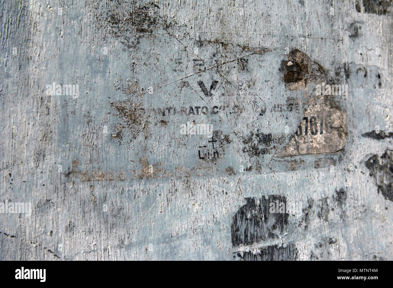 Faded poster on wall, Macau, China Stock Photo - Alamy