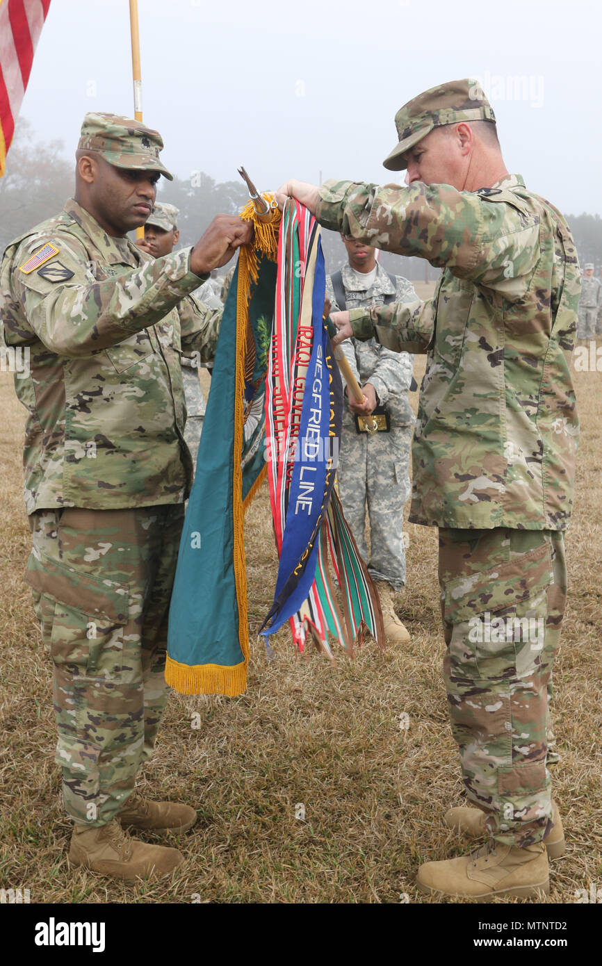 Lt. Col. Kendrick Cager cases the Special Troops Battalion flag during ...