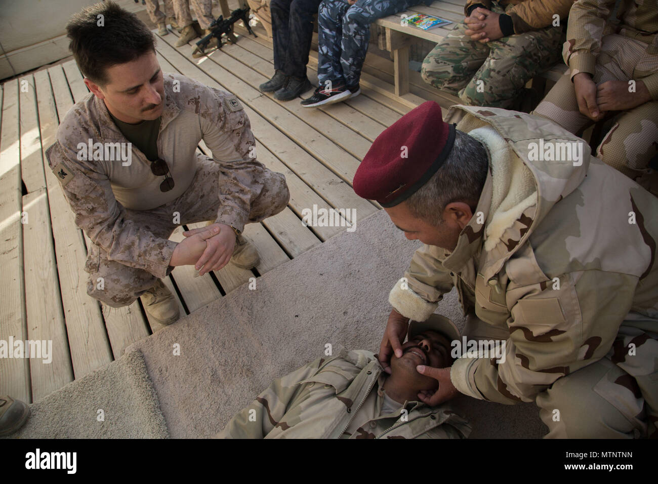 U.S. Navy Petty Officer 1st Class Jeric Martin, a corpsman assigned to ...