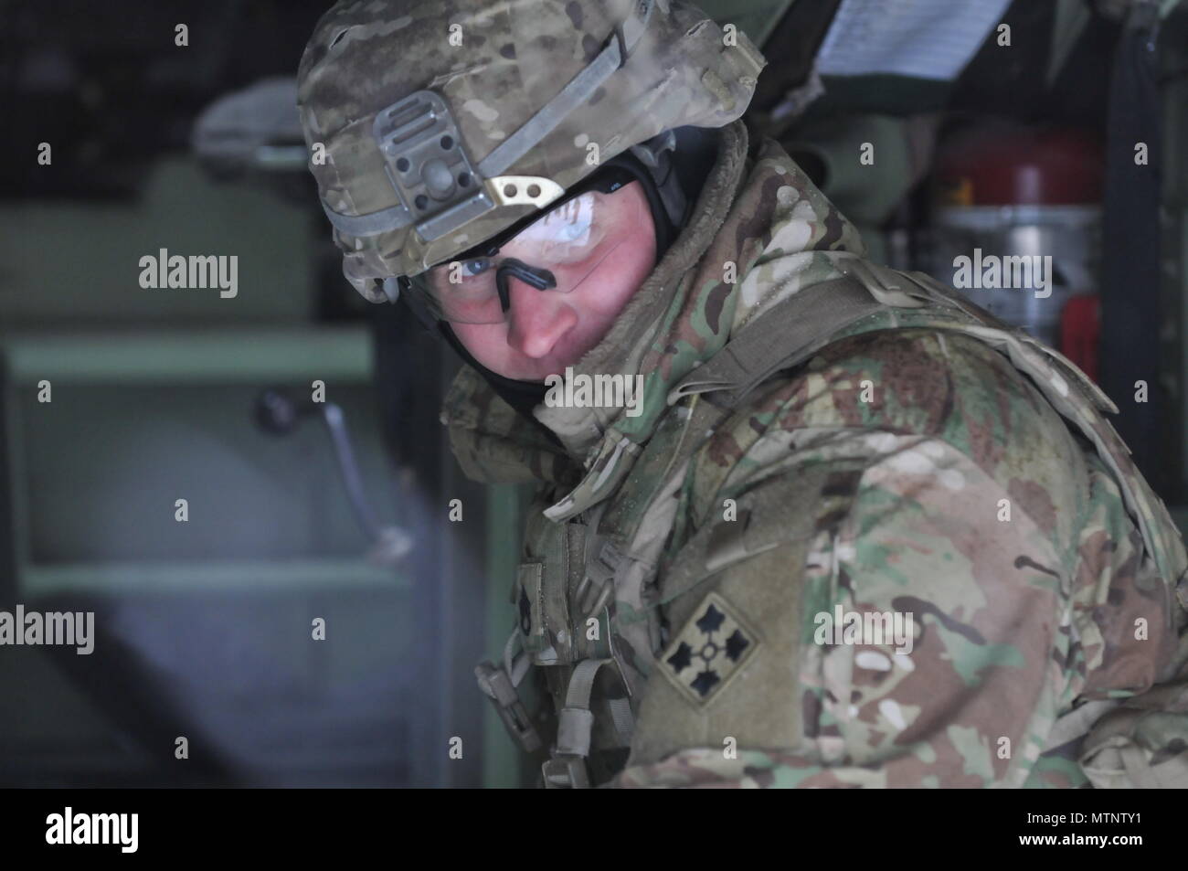 A U.S. Army M2A2 Bradley Fighting Vehicle crew member, 1st Battalion ...